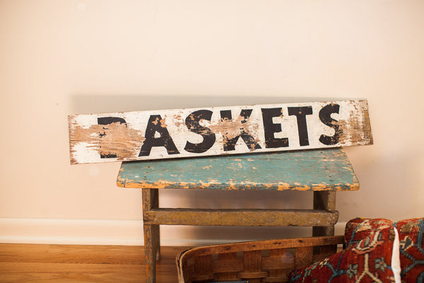 Weathered Wooden Baskets Sign